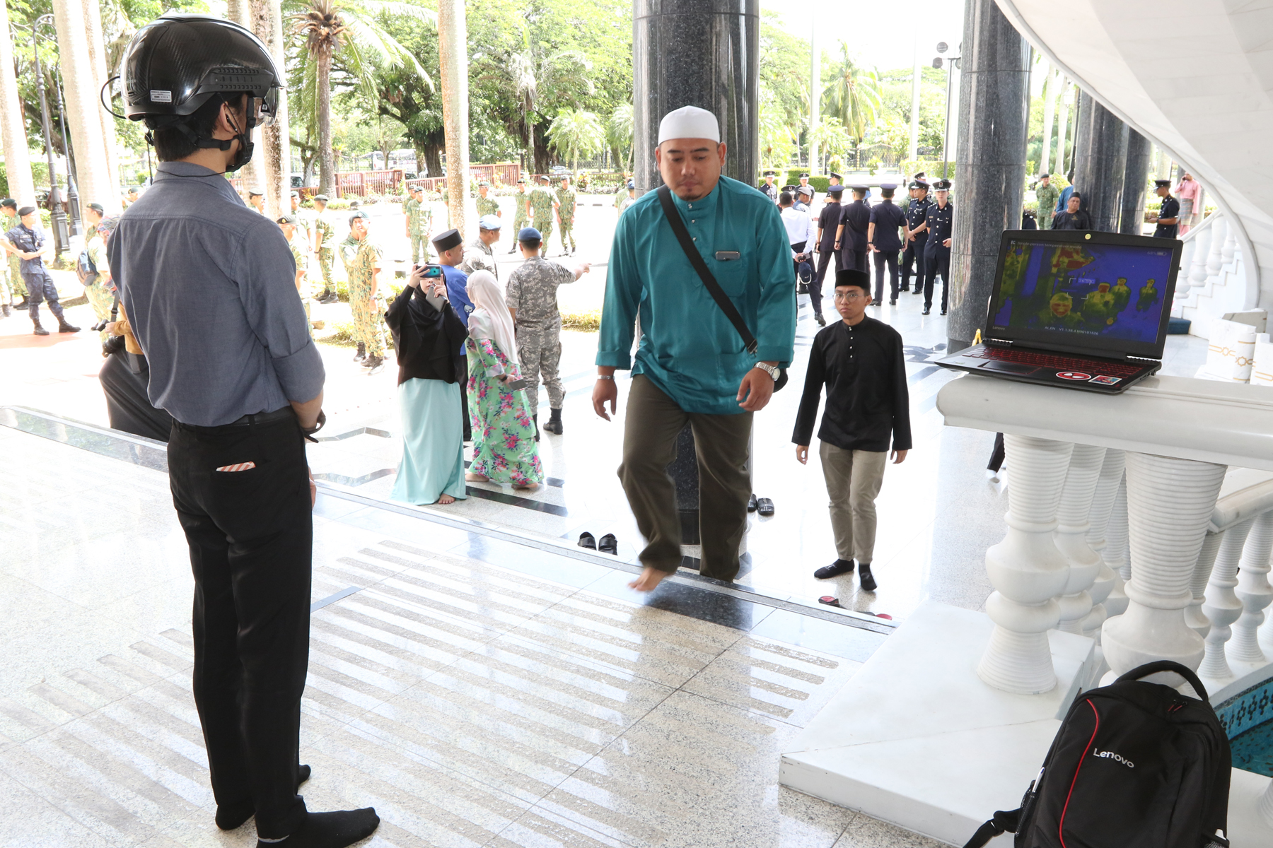 Mosques use smart helmets to detect fever among worshippers - The Scoop